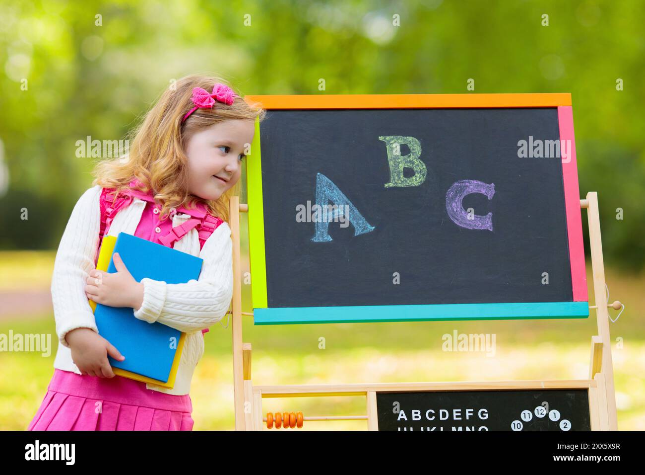 Children happy to be back to school. Preschooler girl and boy with ...