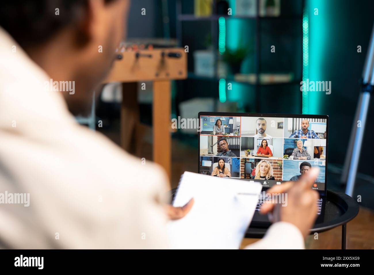 Remote employee in video conference meeting chatting with multi ethnic ...