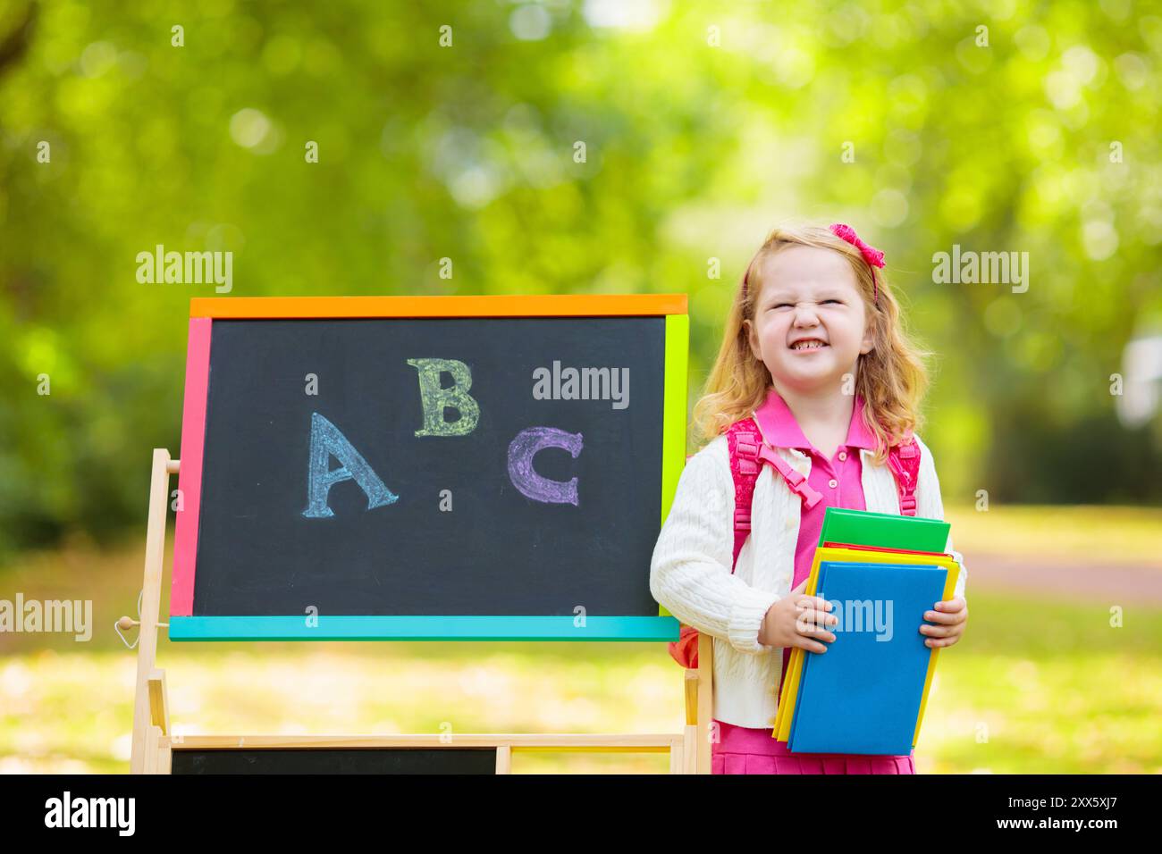 Children happy to be back to school. Preschooler girl and boy with ...