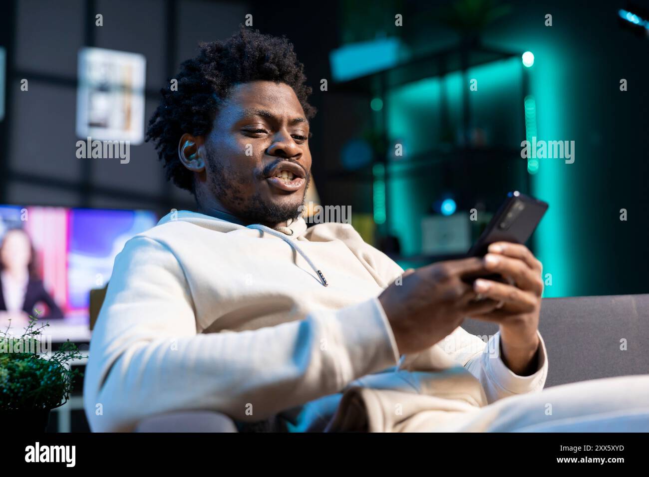 Happy person chatting with online friends on phone, enjoying himself in ...