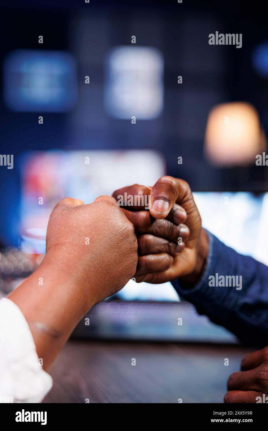 Detailed view of african american individuals fist bumping with each ...