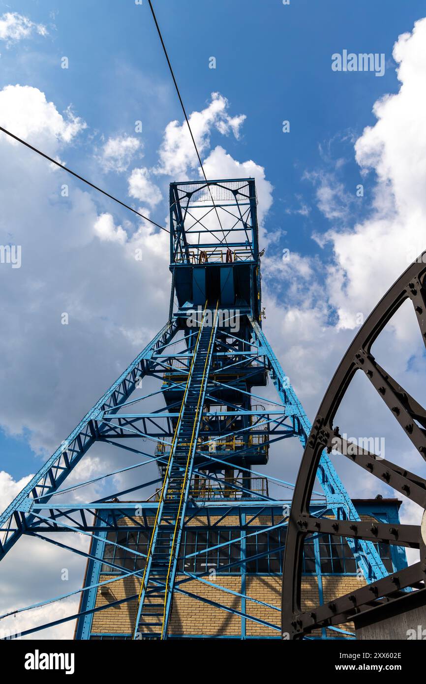 Blue coal mine shaft against a blue sky with delicate clouds. Reduction ...