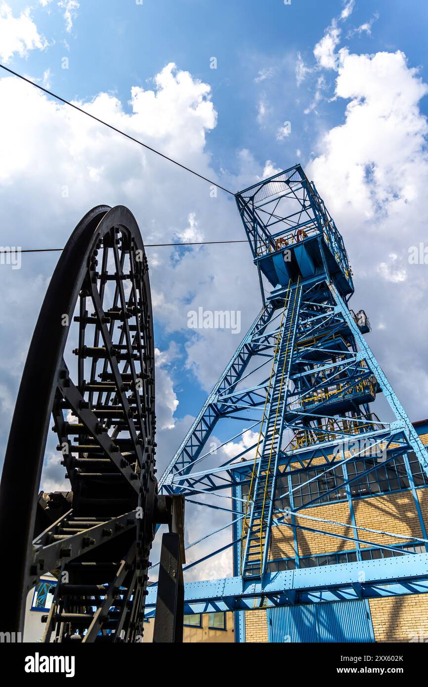 Blue coal mine shaft against a blue sky with delicate clouds. Reduction ...