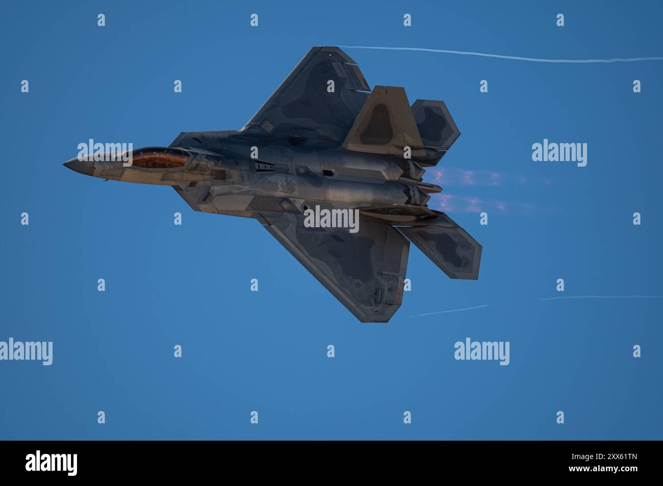 An F-22 Raptor aircraft flies during the Heritage Flight Training ...
