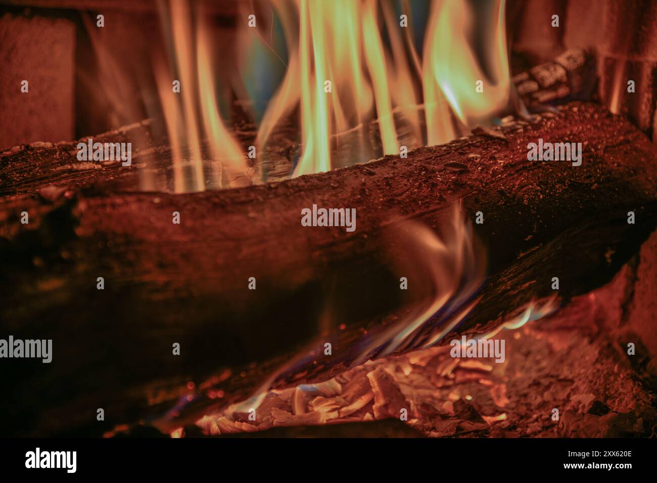 Stock image of a roaring wood fire in fire place with real wood and ...