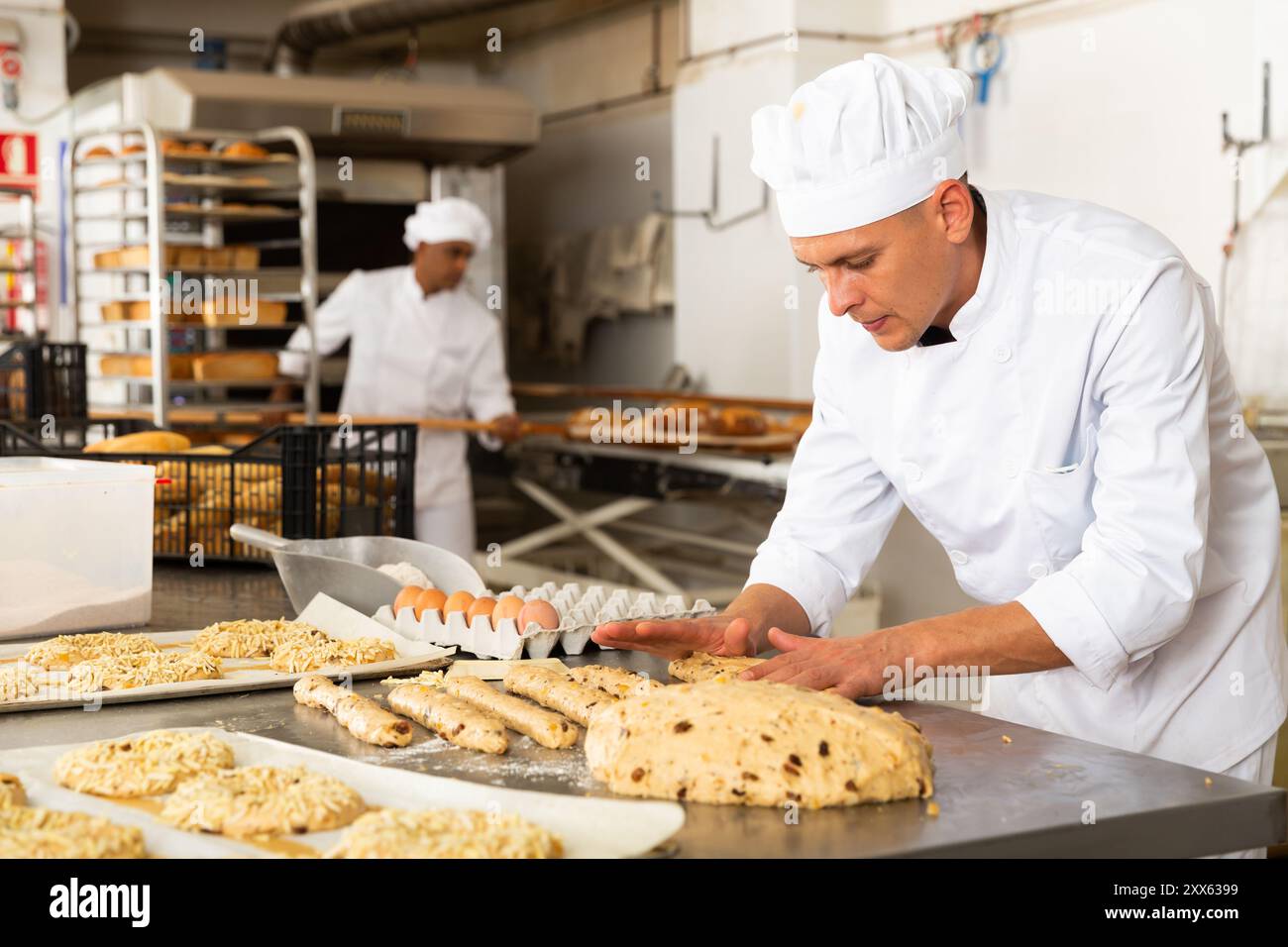 portrait male baker making cookies in bakehouse Stock Photo - Alamy