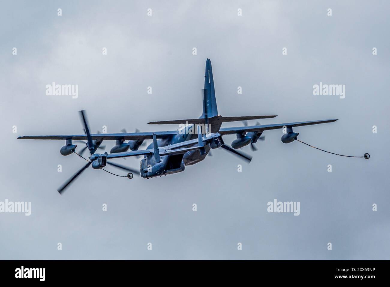 C130 Hercules and Bell-Boeing V-22 Osprey flying in refuelling ...