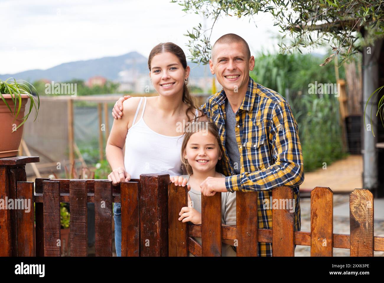 Portrait of friendly family in the courtyard of country house Stock ...