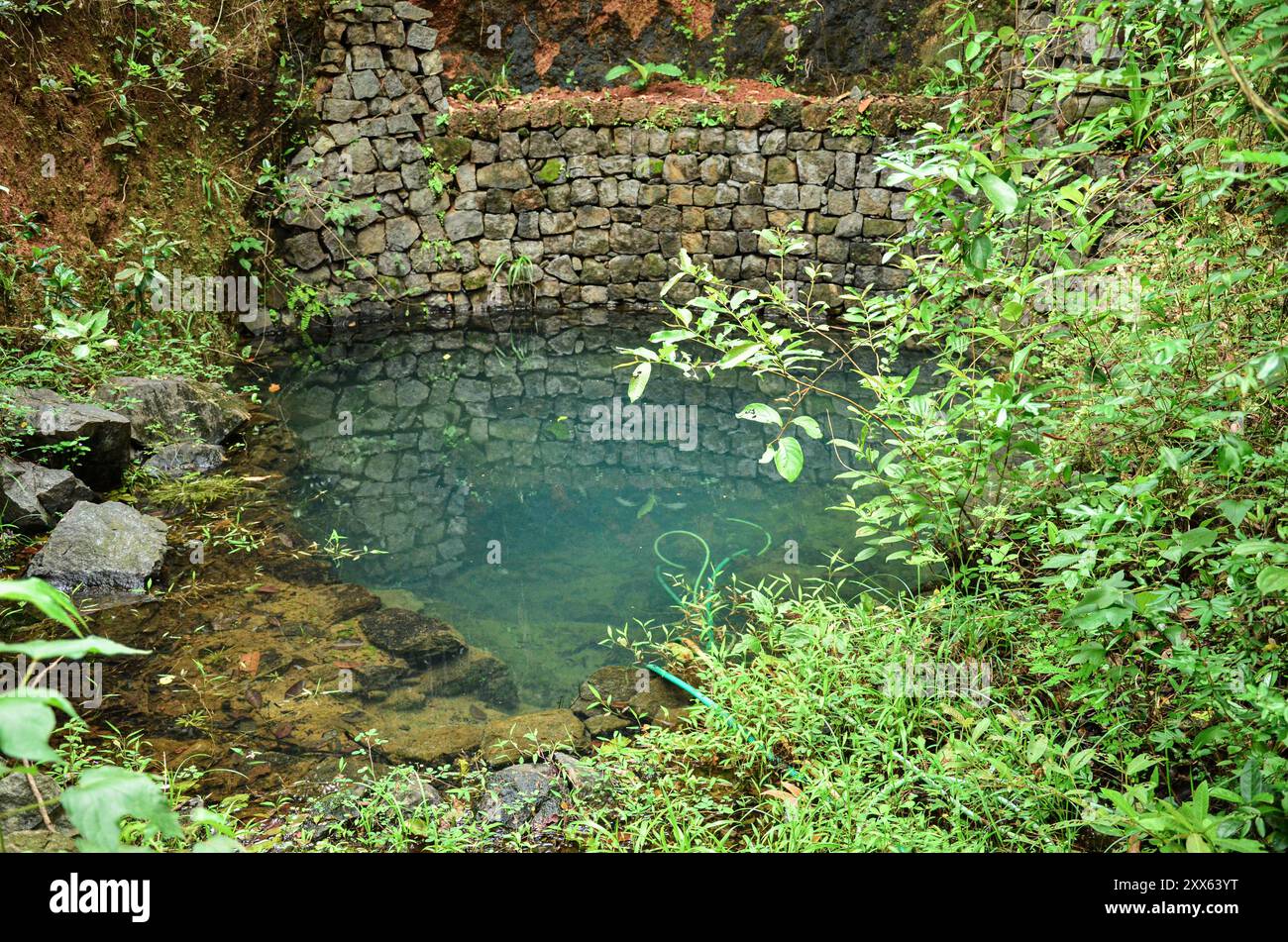Open spring water well in a village Stock Photo - Alamy