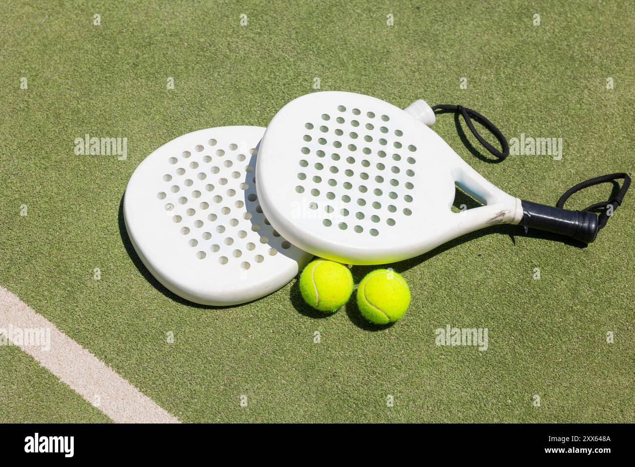Rackets and balls for playing padel on an outdoor tennis court Stock ...