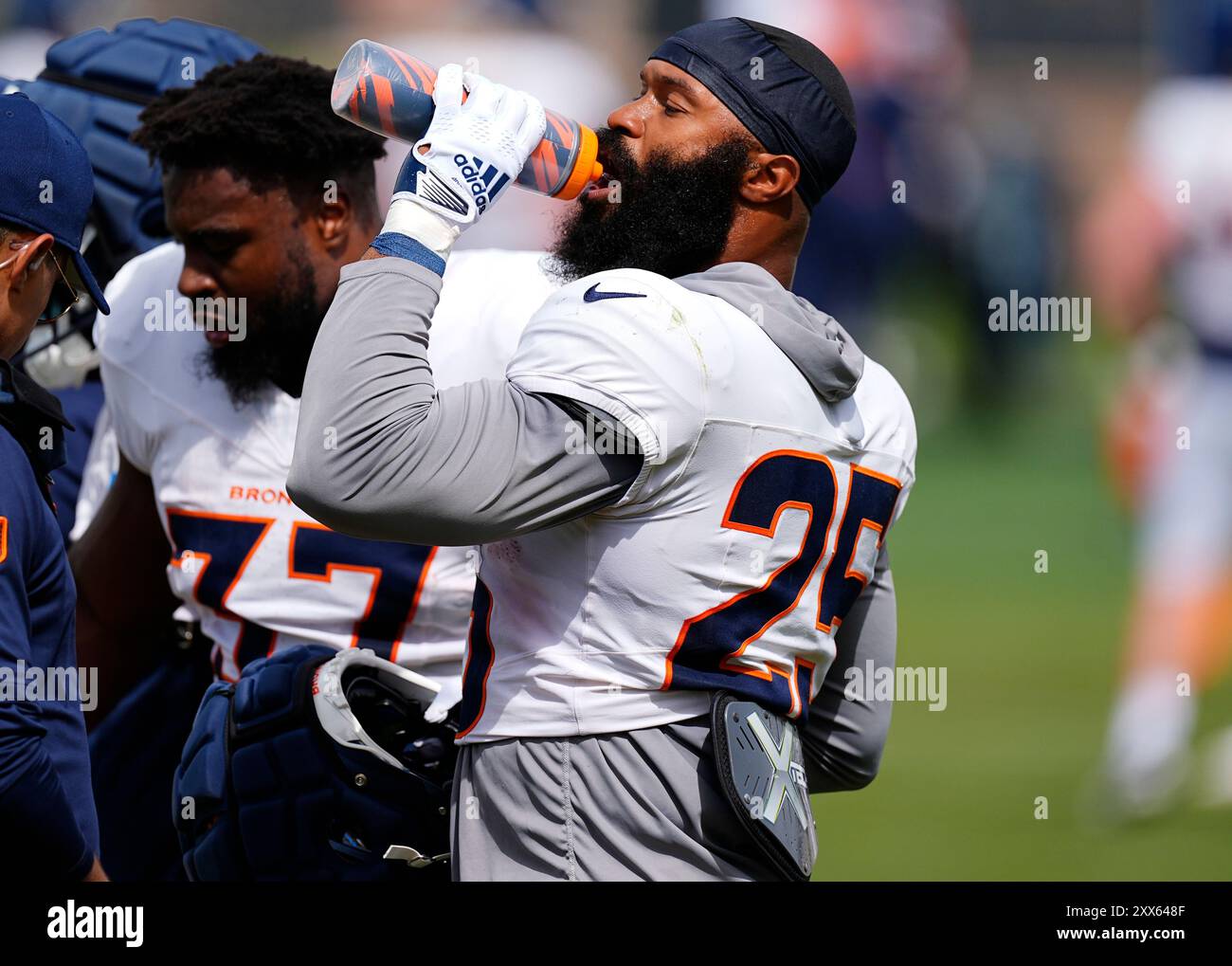 Denver Broncos running back Samaje Perine drinks as temperatures soared ...