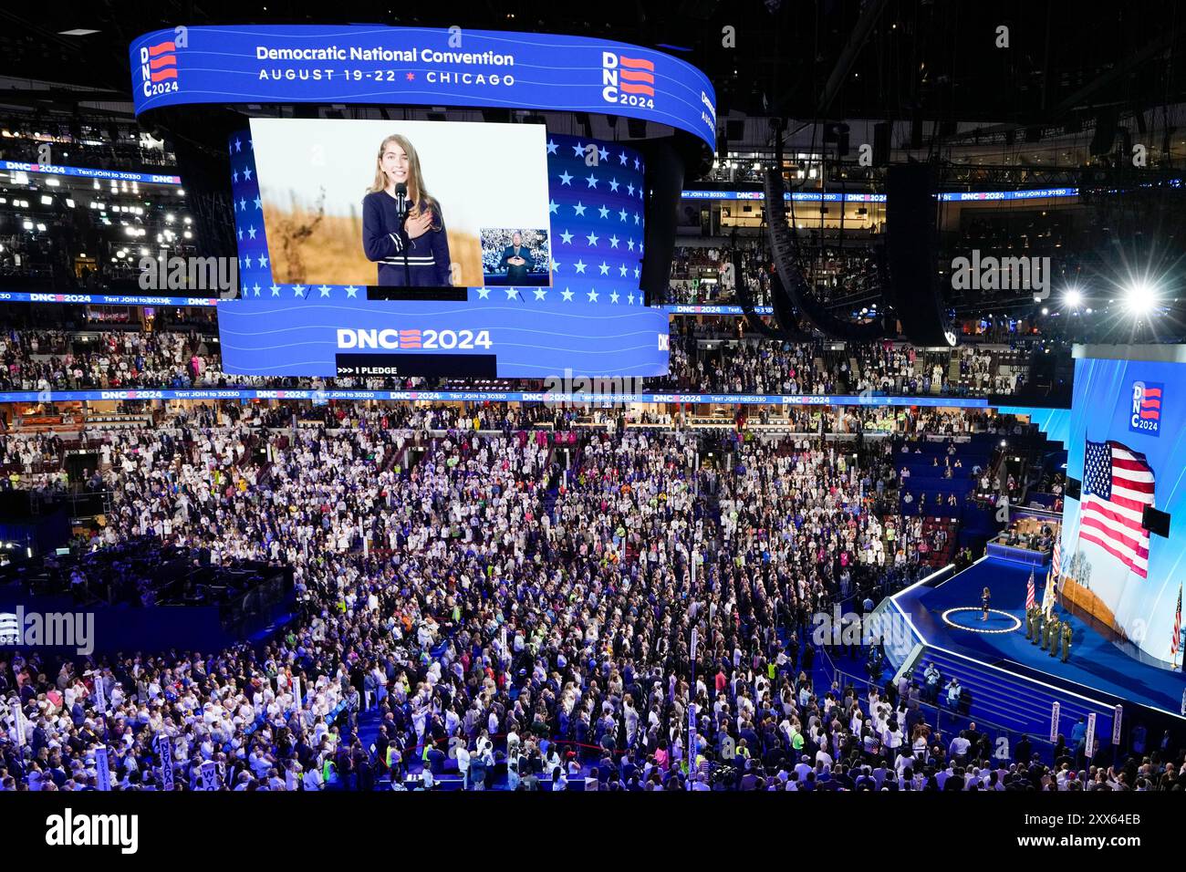 People in the crowd wear white during the Pledge of Alliegence during ...