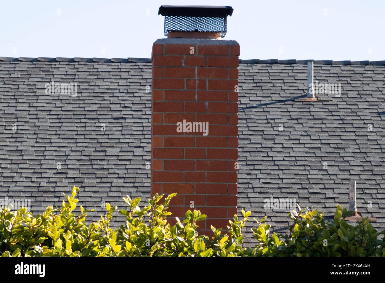 red brick chimney on house roof Stock Photo - Alamy