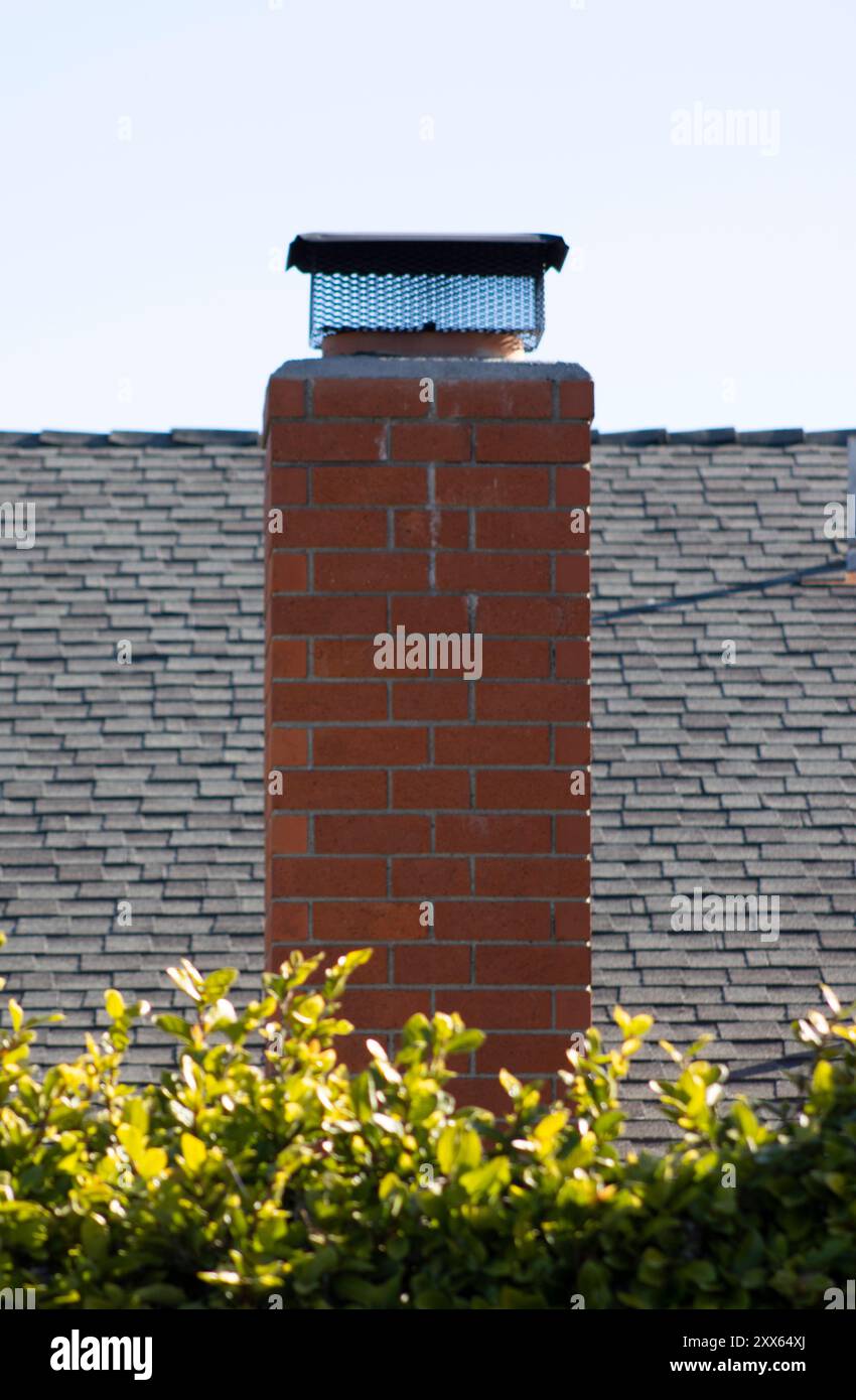 red brick chimney on house roof Stock Photo - Alamy