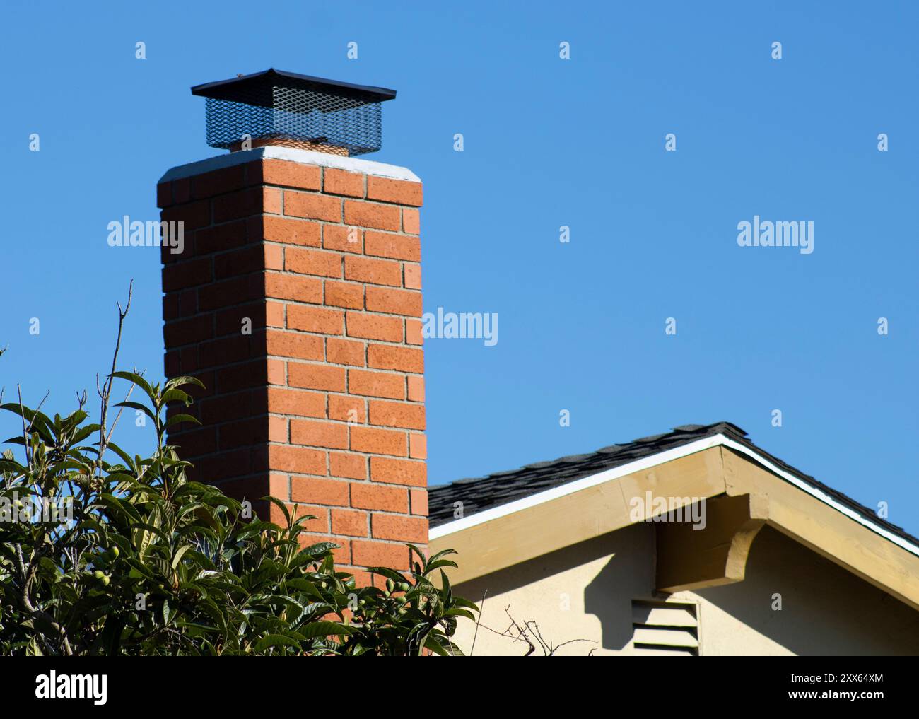 red brick chimney on house roof Stock Photo - Alamy