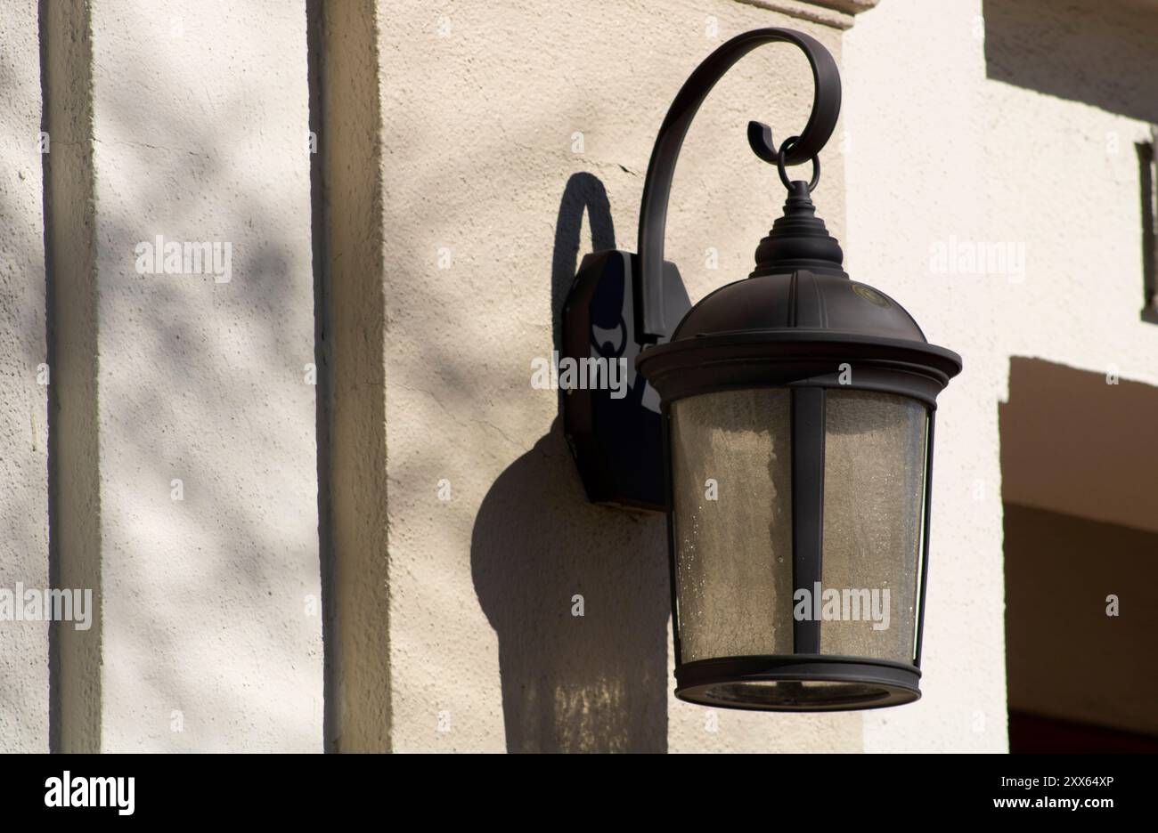 iron lamp light on side of church Stock Photo - Alamy