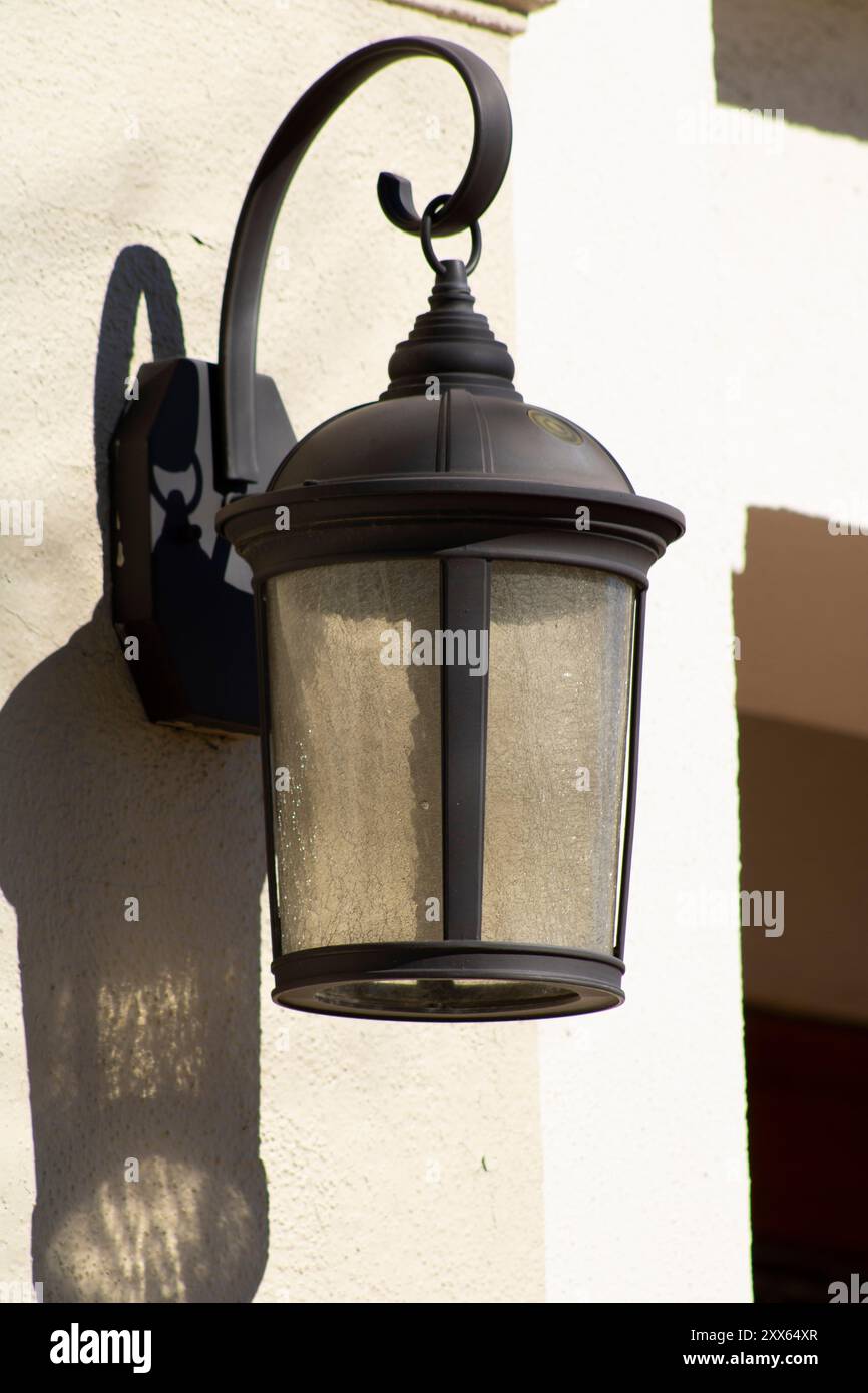 iron lamp light on side of church Stock Photo - Alamy