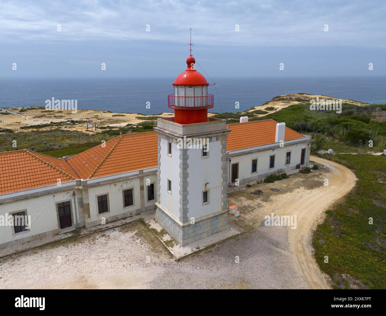 Close-up of a lighthouse and a neighbouring building overlooking the ...