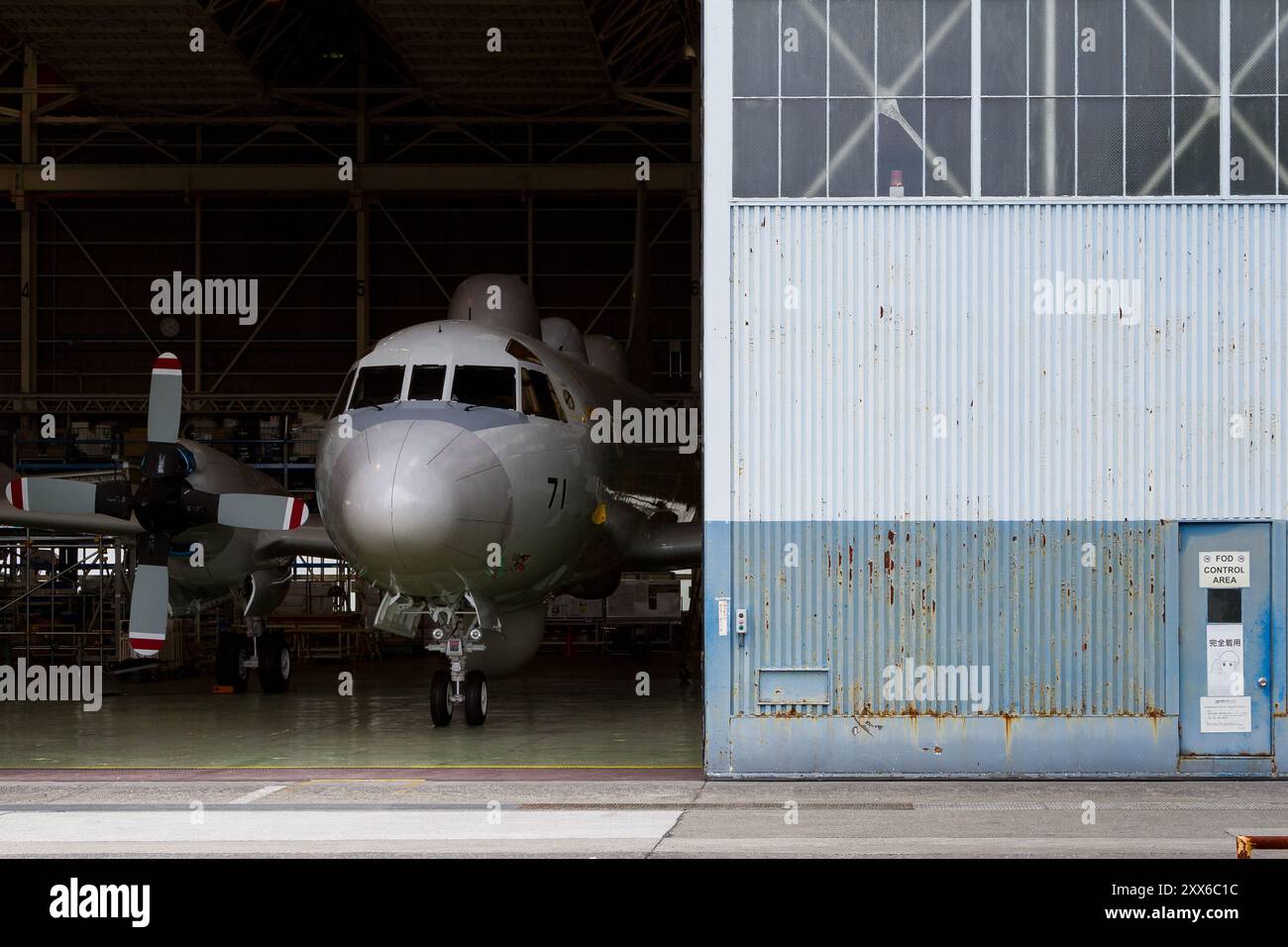 A Lockheed EP3 Orion ELINT signals reconnaissance aircraft being serviced in a hanger on Naval ...