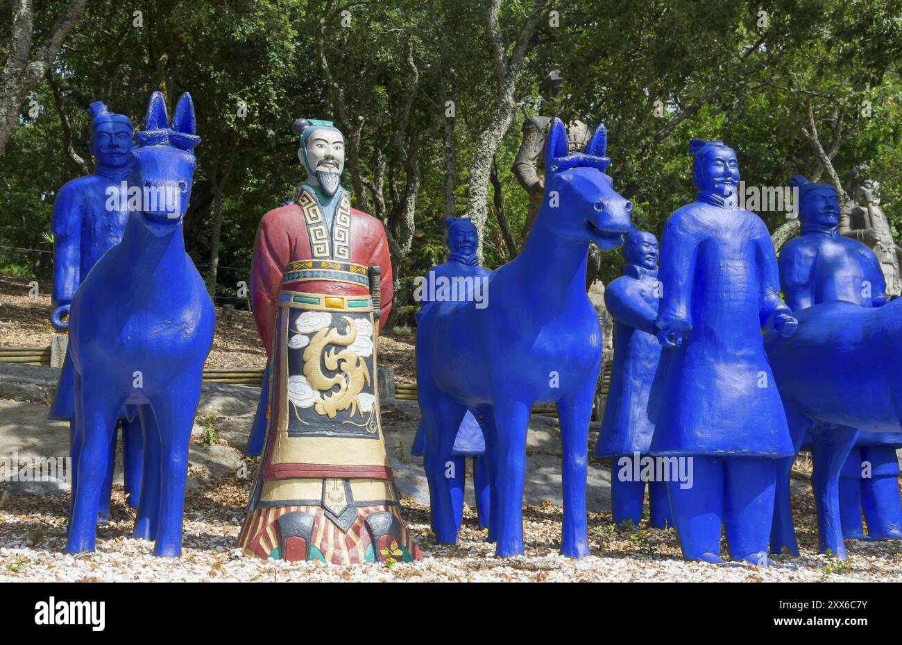Blue terracotta soldiers and horse statues with a painted soldier in a ...