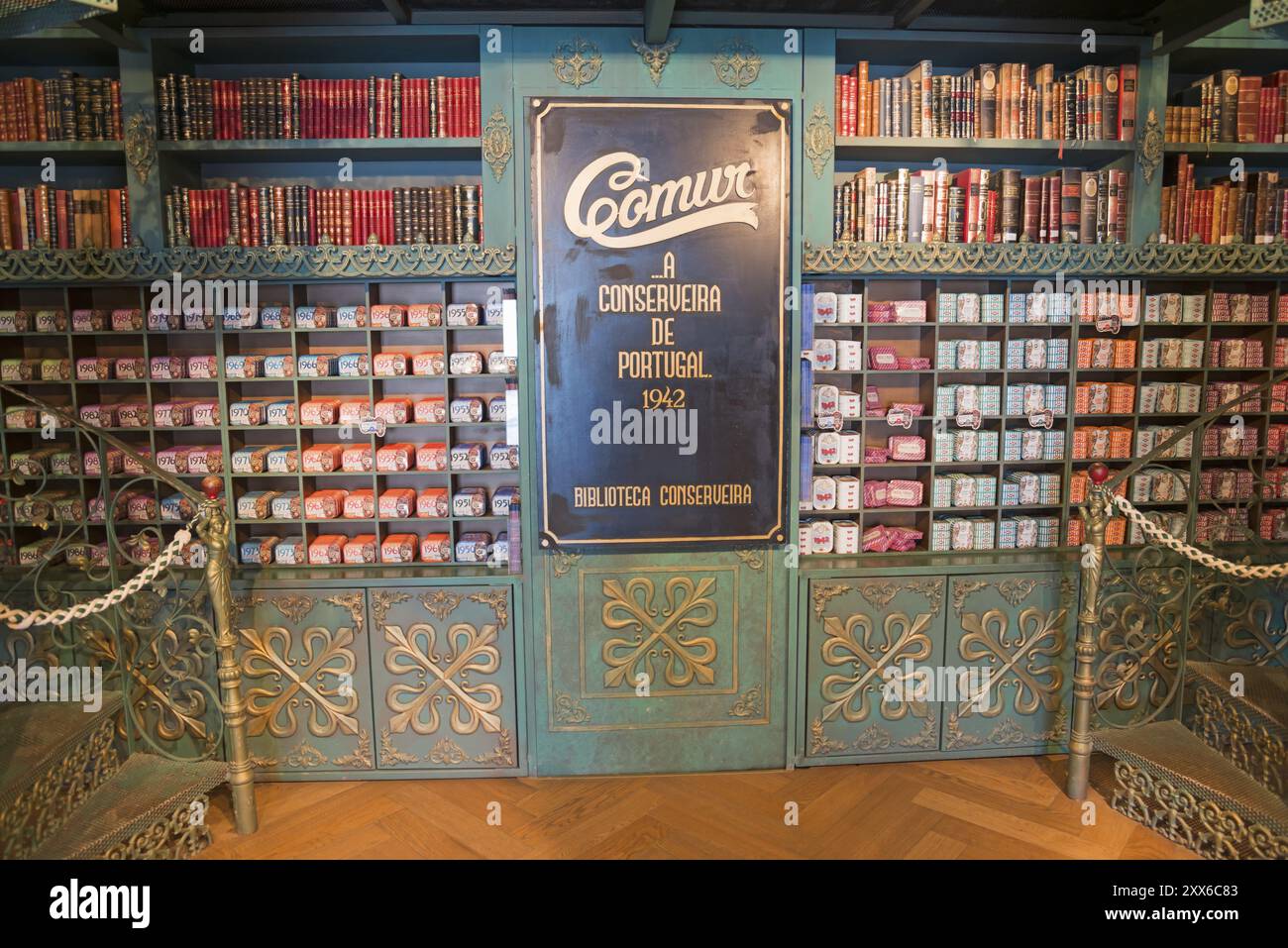 Classic shop with shelves displaying books and colourful preserves in ...