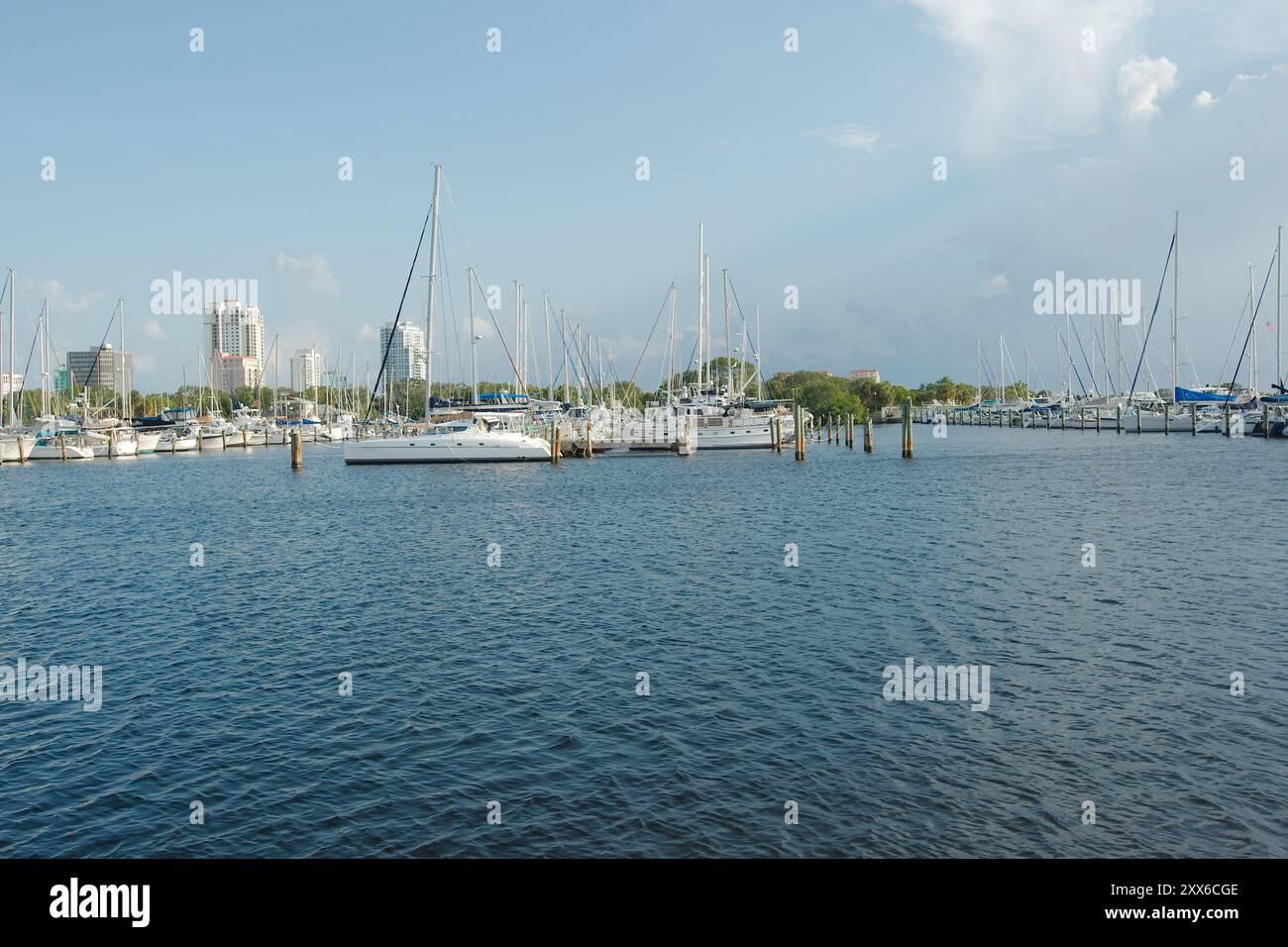 Wide shot Looking north from Demens Landing Park over bright blue water ...