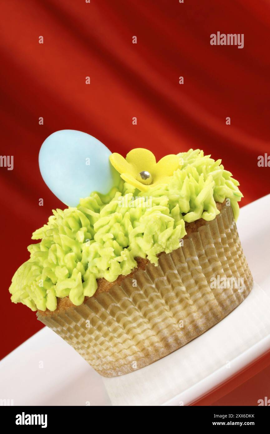Fancy Easter cupcake decorated with sugar flower and hard sugar coated ...