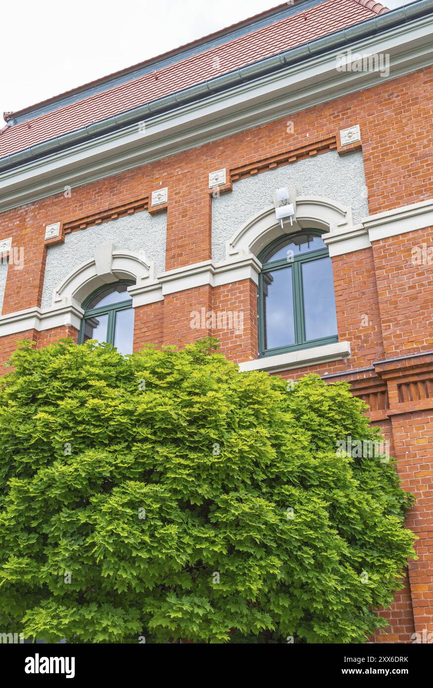 Brick facade of a refurbished industrial building Stock Photo - Alamy