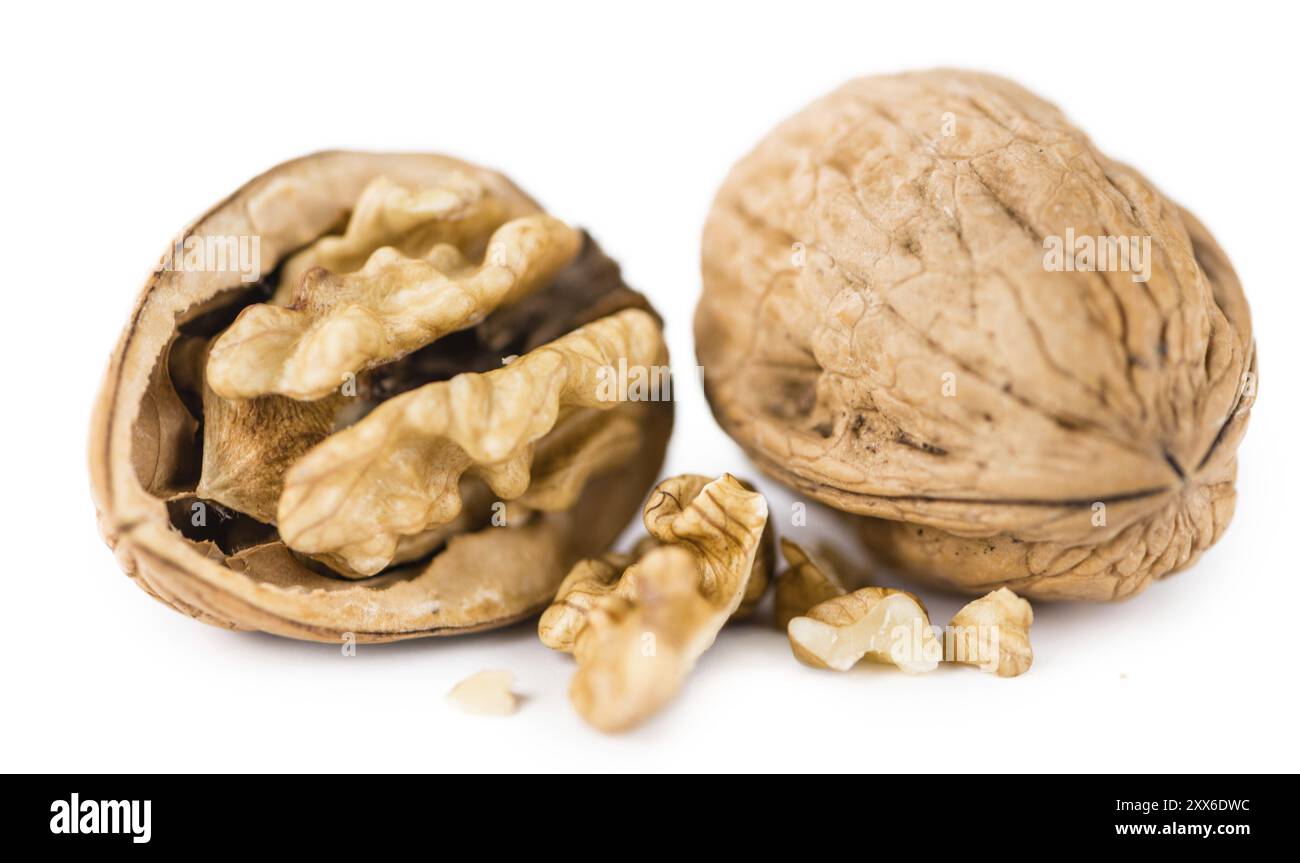 Portion of Walnuts (as close-up shot) isolated on white background ...