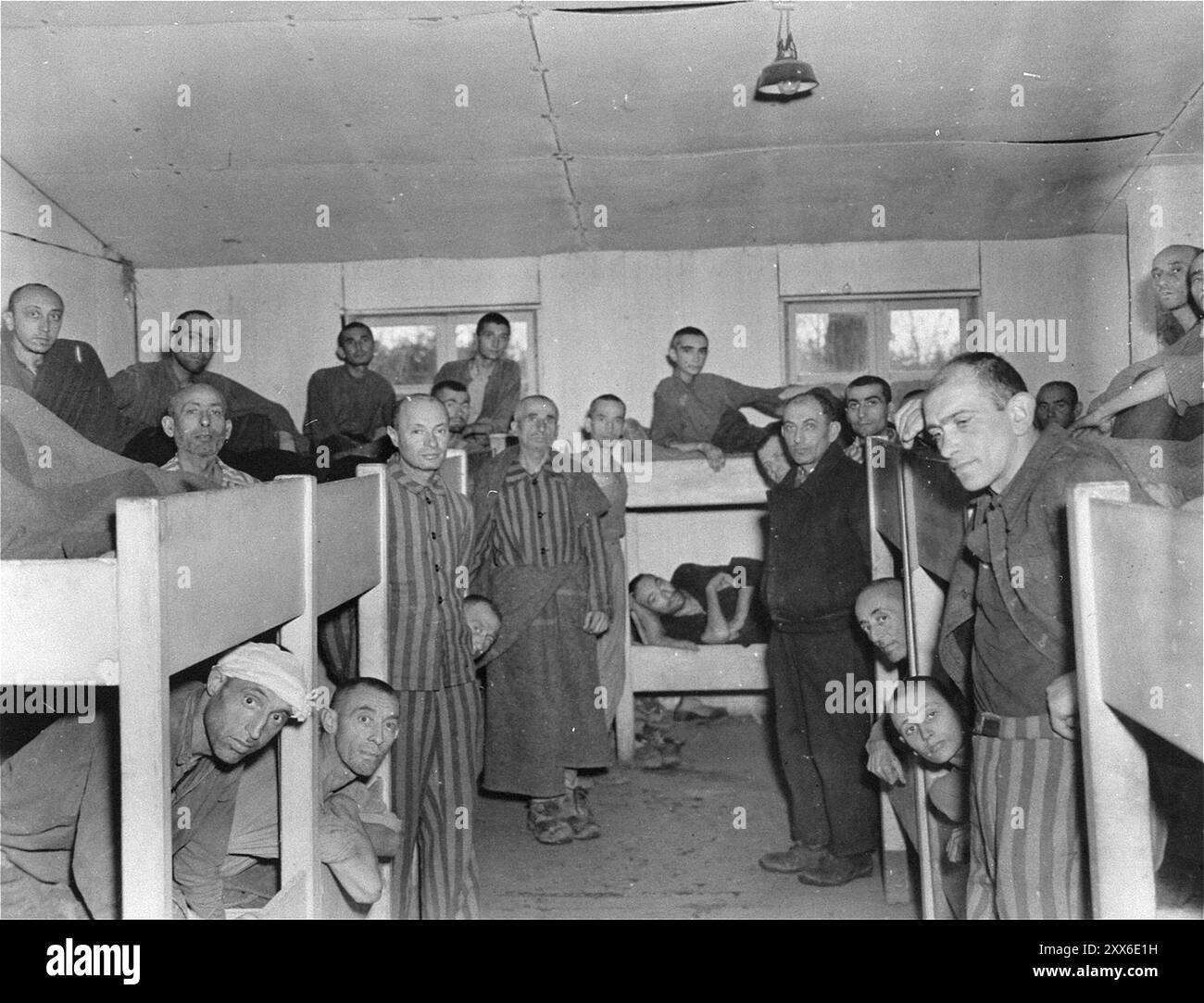 Survivors in a barracks in the Ampfing concentration camp several days ...