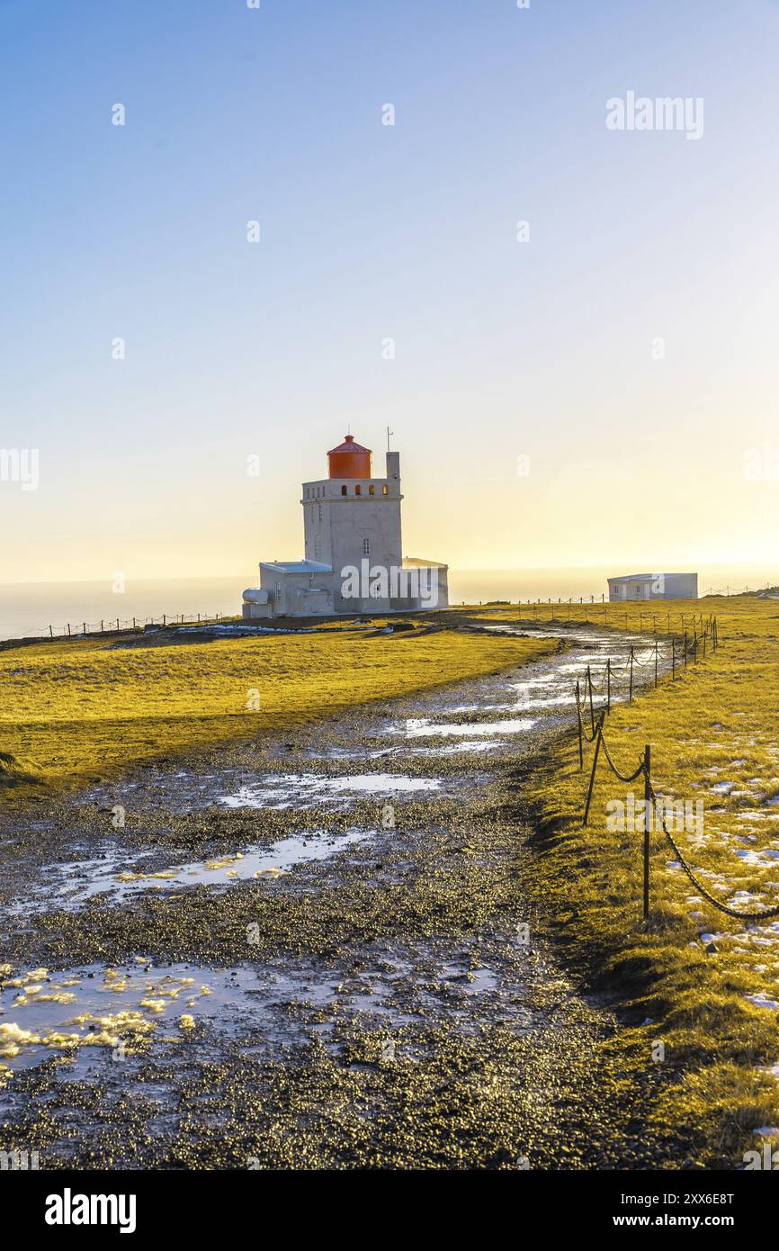 Trail leading to the famous lighthouse at sunset on Dyrholaey beach in ...