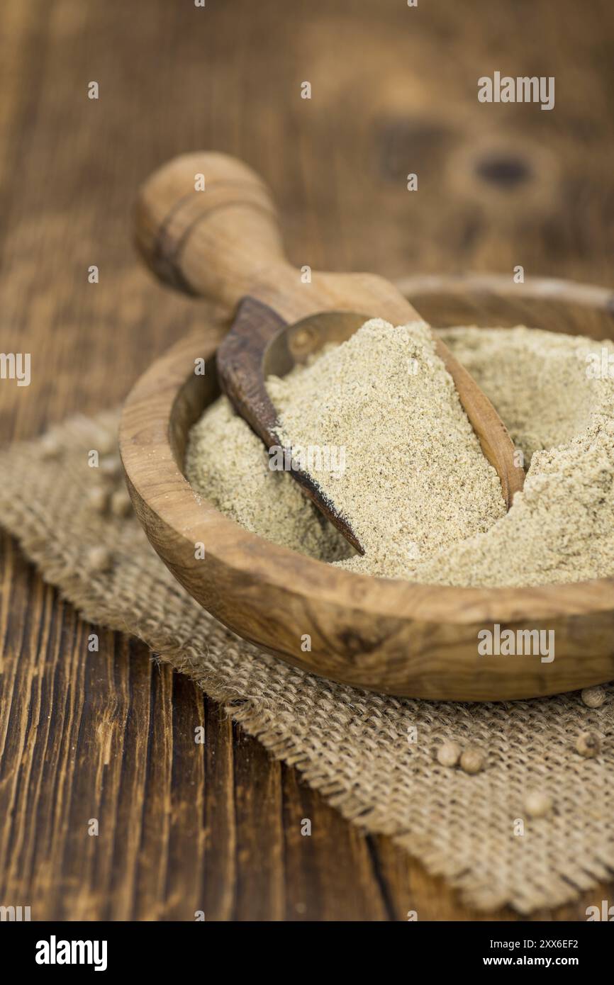 Fresh made White Pepper on a vintage background as detailed close-up ...