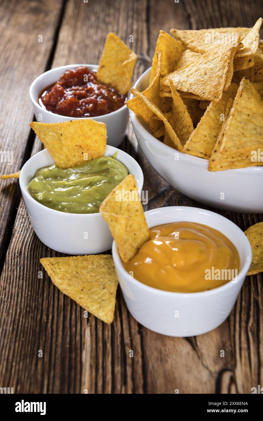 Three different nacho dips (Salsa, Cheese and Guacamole Stock Photo - Alamy