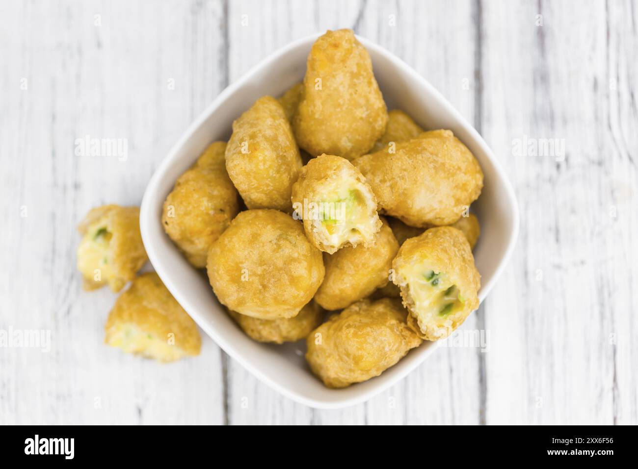 Chili Cheese Nuggets on a vintage background as detailed close-up shot ...