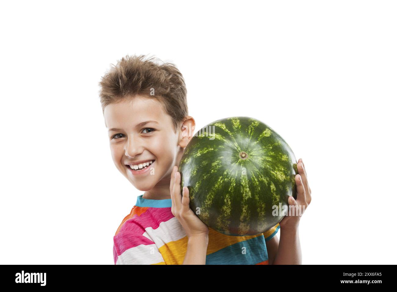 Handsome smiling child boy hand holding green ripe watermelon fruit ...