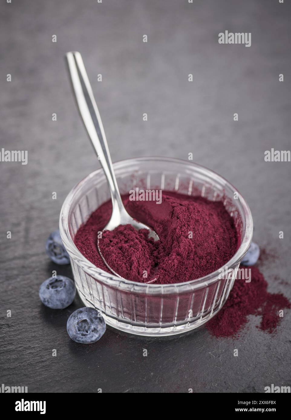 Fresh made Blueberry Powder on a vintage background as detailed close ...