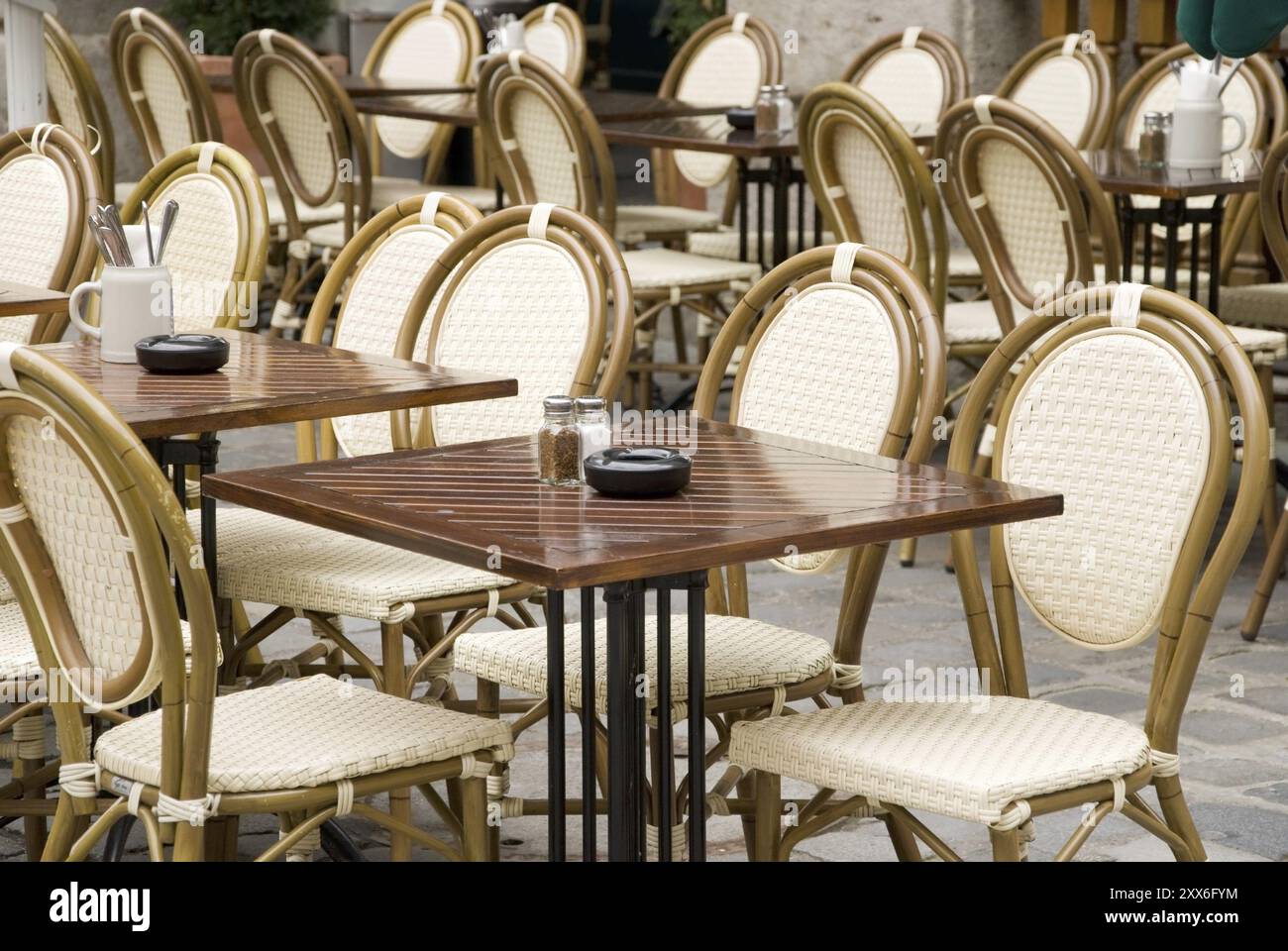 Typical munich stgreet cafe with wicker chairs Stock Photo - Alamy