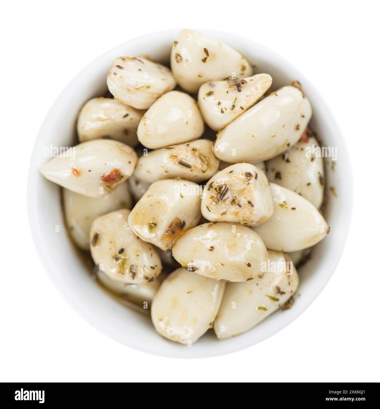 Portion of Preserved Garlic (as close-up shot) isolated on white ...