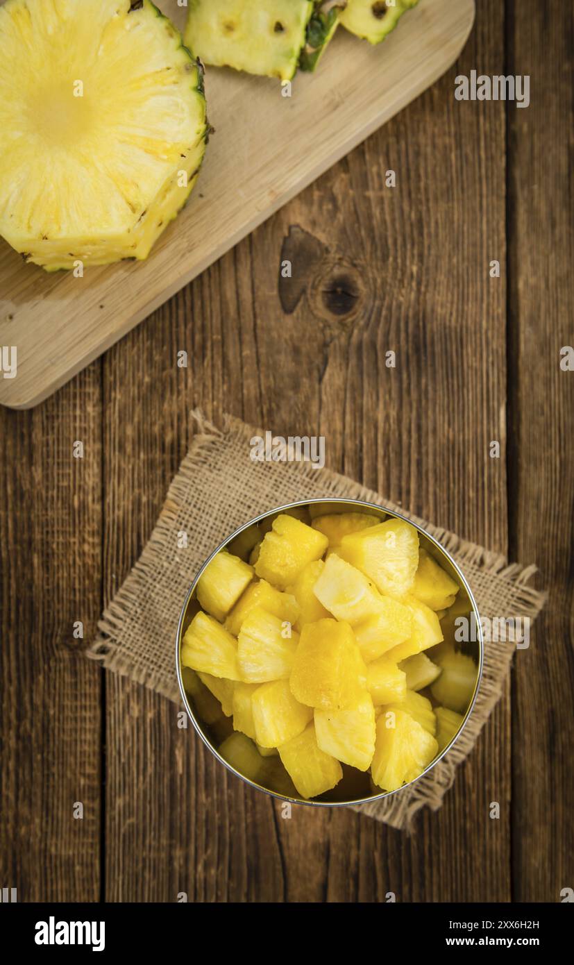 Fresh made Pineapple (sliced) on a vintage background as detailed close ...