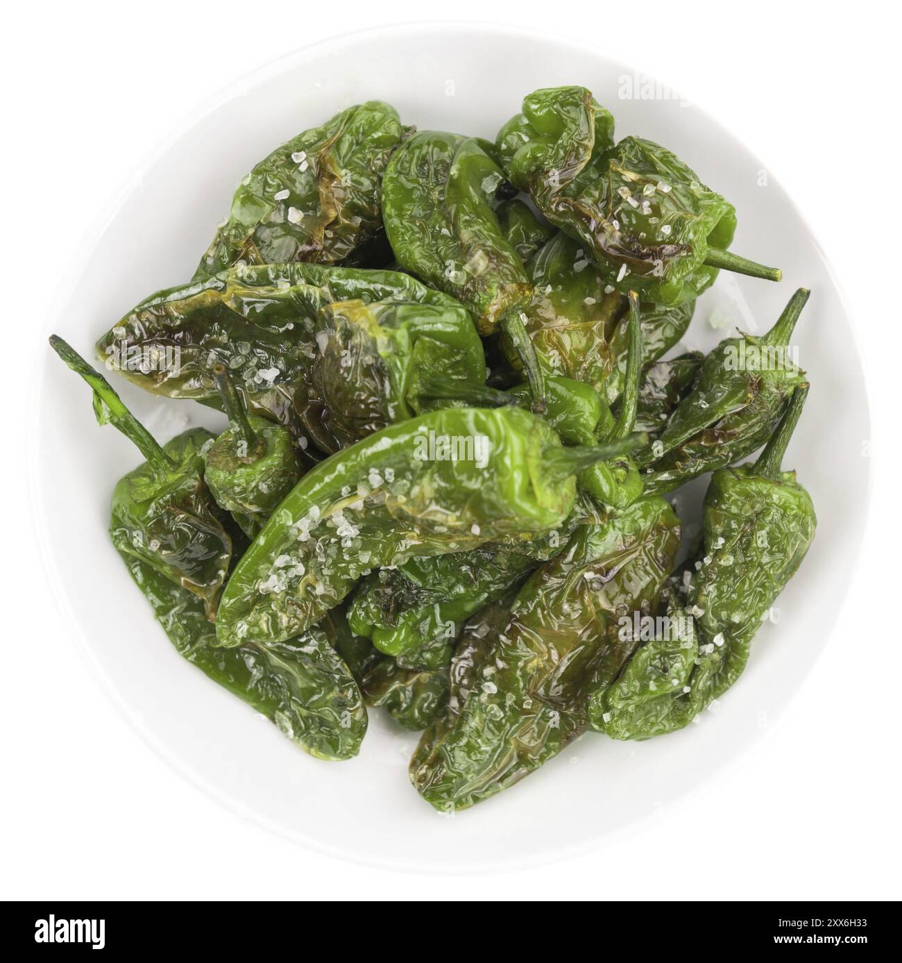 Portion of Pimientos de Padron as detailed close-up shot isolated on ...