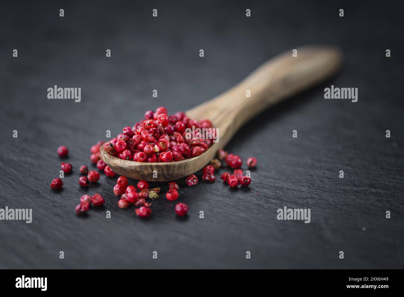 Pink Peppercorns on a vintage background as detailed close-up shot ...
