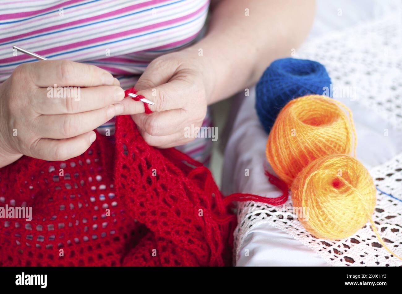 Women's hands are knitted shawl Stock Photo - Alamy