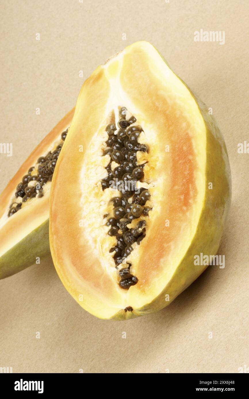 Closeup of a half cut ripe papaya Stock Photo - Alamy
