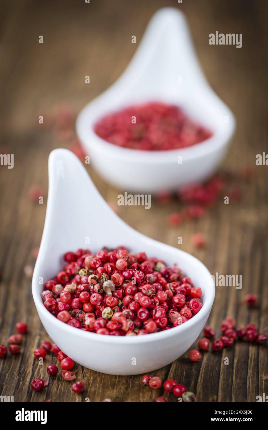Pink Peppercorns on a vintage background as detailed close-up shot ...