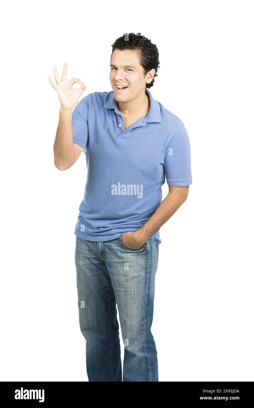 Hispanic male wearing blue smiling warmly, gesturing OK right hand ...