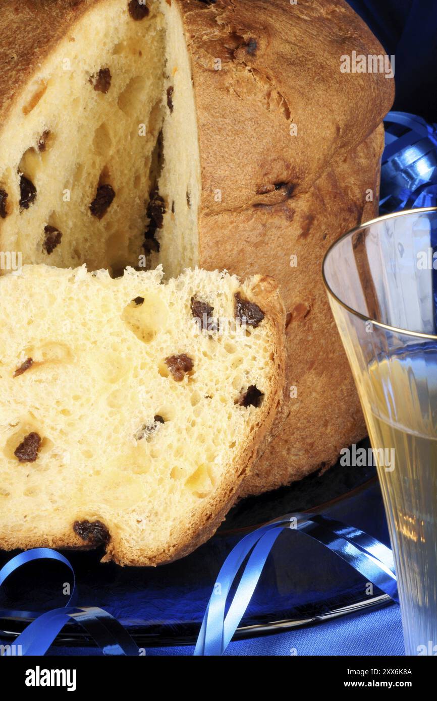 Panettone the italian Christmas fruit cake served on a blue glass plate ...