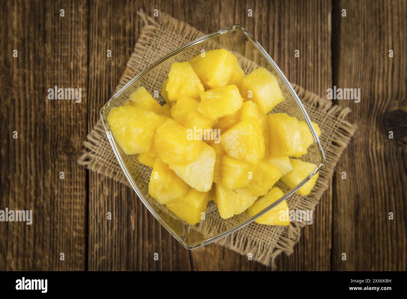 Fresh made Pineapple (sliced) on a vintage background as detailed close ...