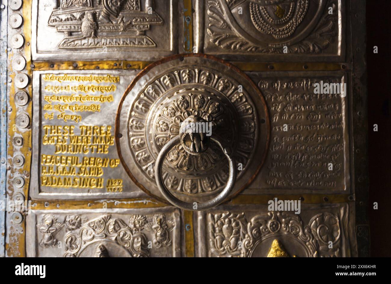 The ornamental metal door knocker and door at the entrance to Bhimakali ...
