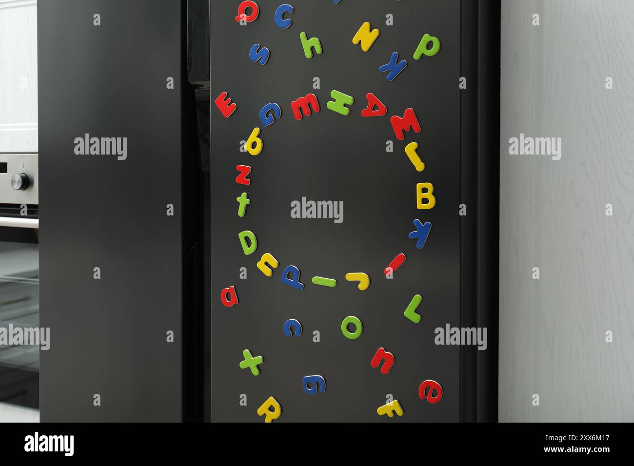 Many bright magnetic letters on fridge indoors. Learning alphabet Stock ...