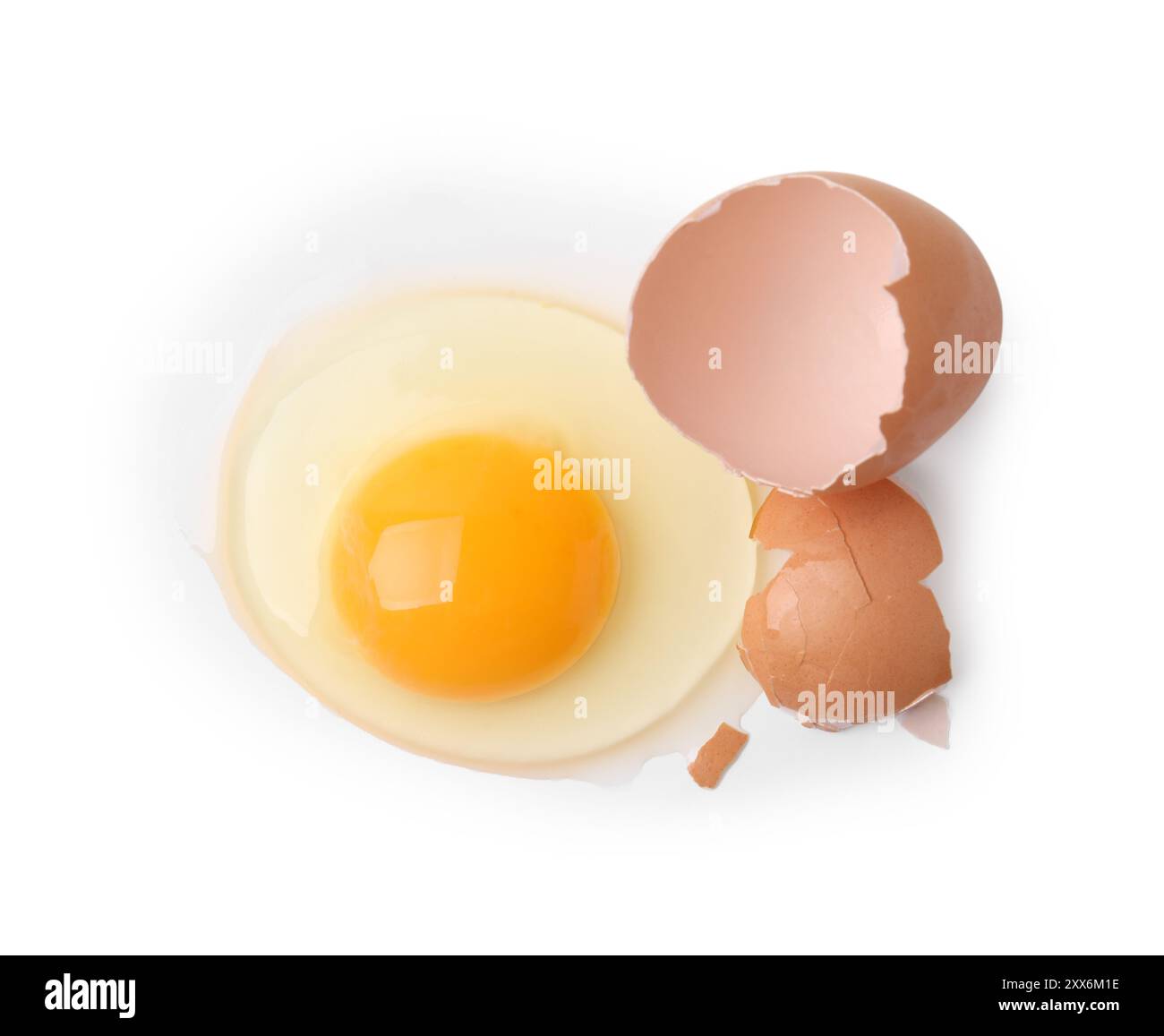 Broken raw egg and shell isolated on white, top view Stock Photo - Alamy